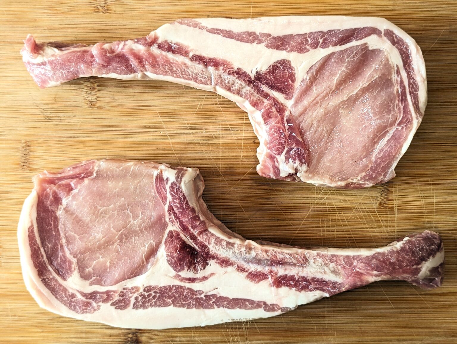 Tender Smoked Tomahawk Pork Chops with Habanero Glaze - What's Smoking